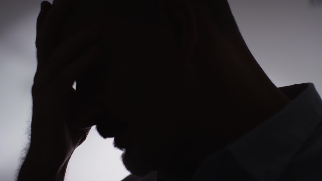 Free stock video - Close up silhouette of depressed mature man struggling with mental health in ...